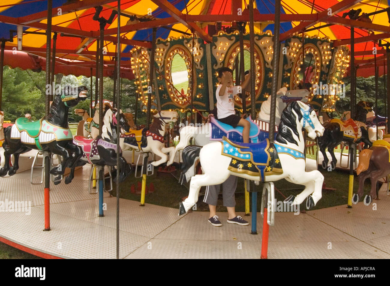 Kids Ride, Merry-go-round Stock Photo - Alamy