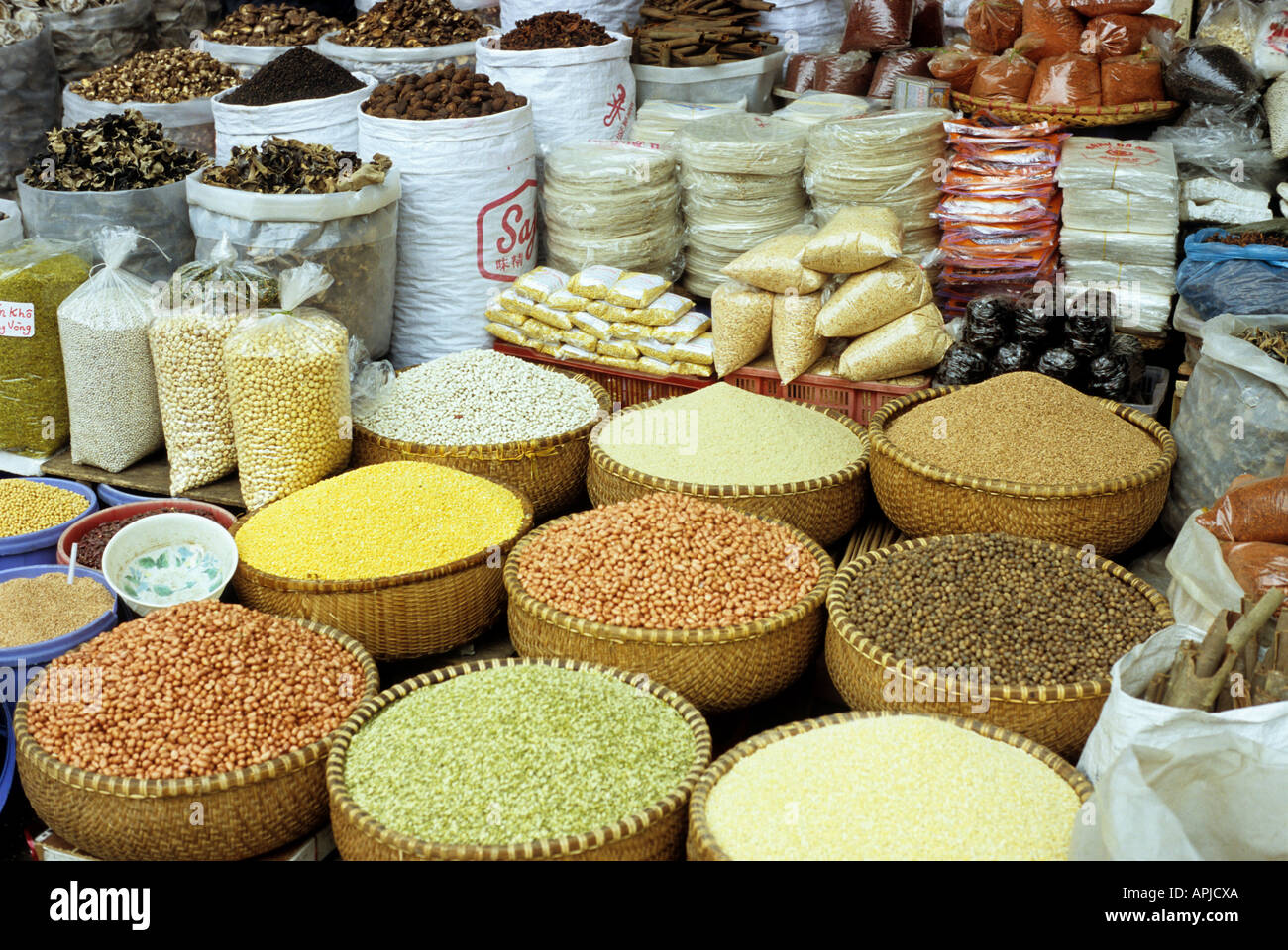 Baskets of dried goods and pulses at a shop in Nguyen Thien Thuat St ...