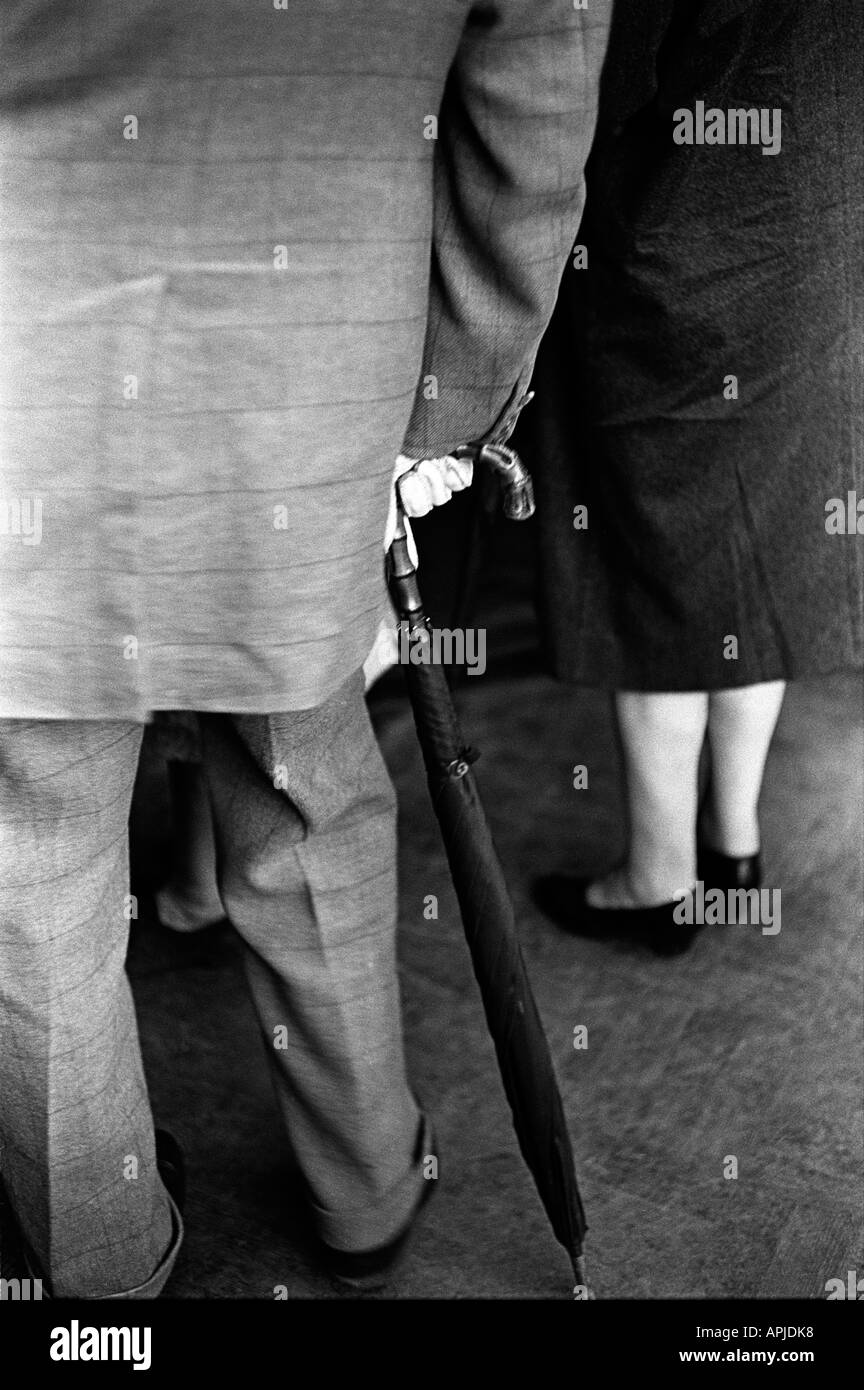 Man holding umbrella Black and White Stock Photos & Images - Alamy