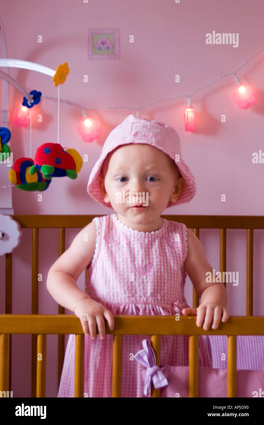 Baby in cot and bedroom Stock Photo - Alamy