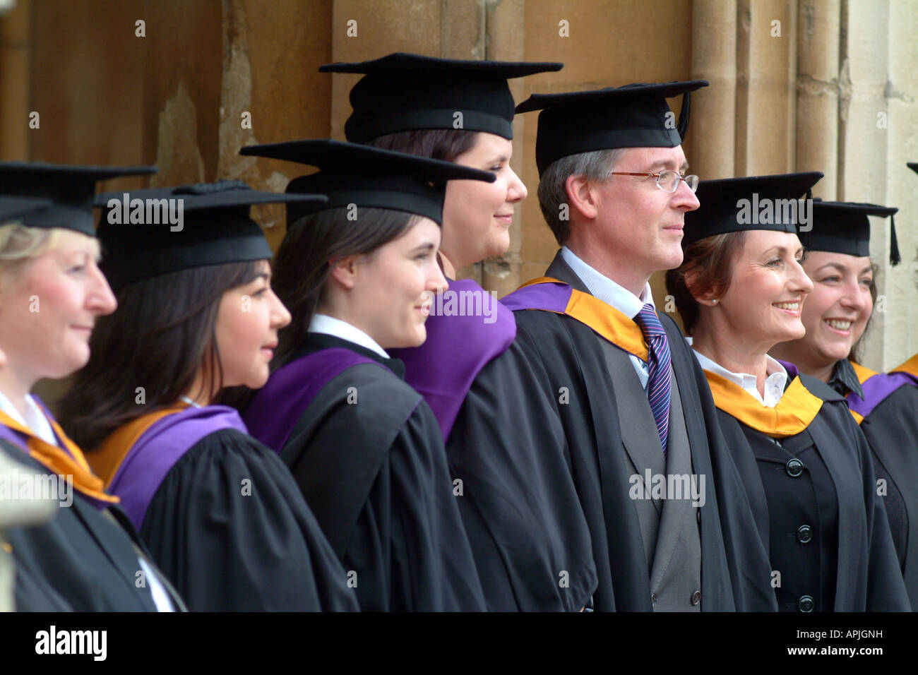 line of graduation students in gowns Stock Photo - Alamy