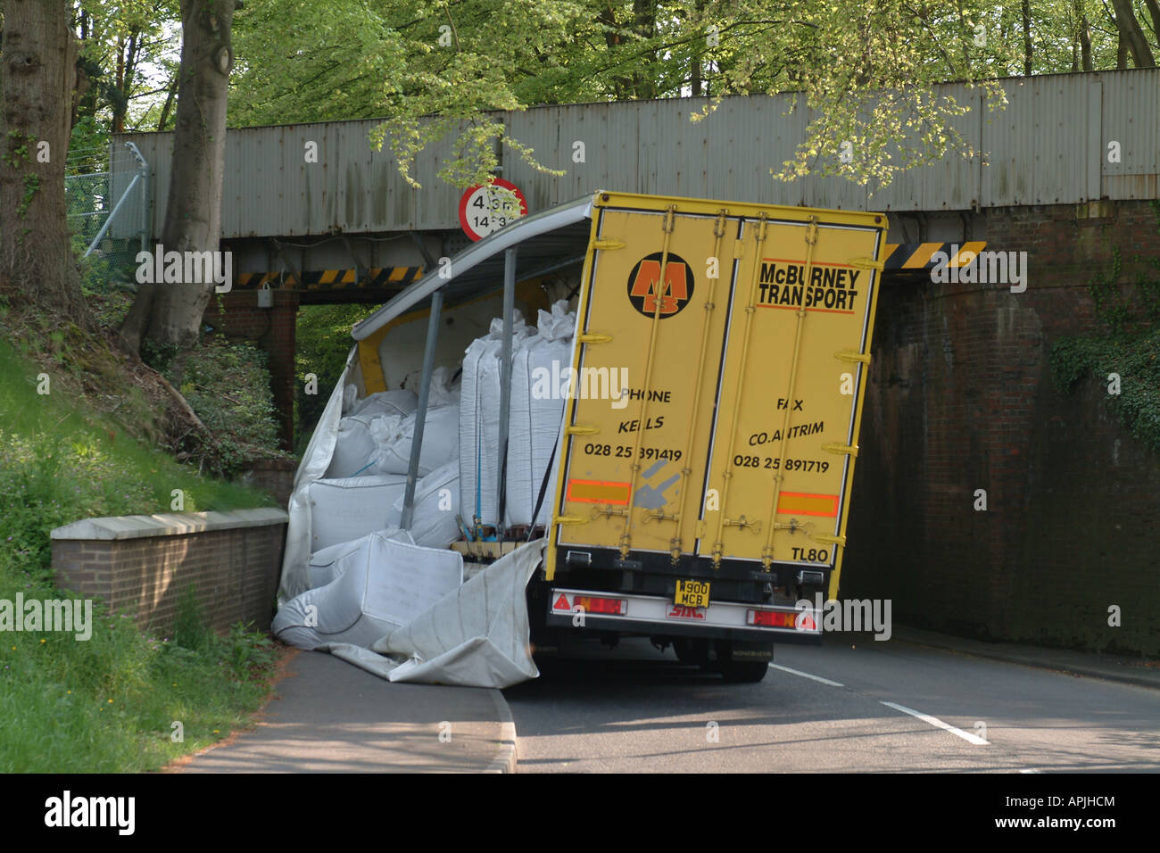 lorry crash under low bridge,truck Stock Photo - Alamy