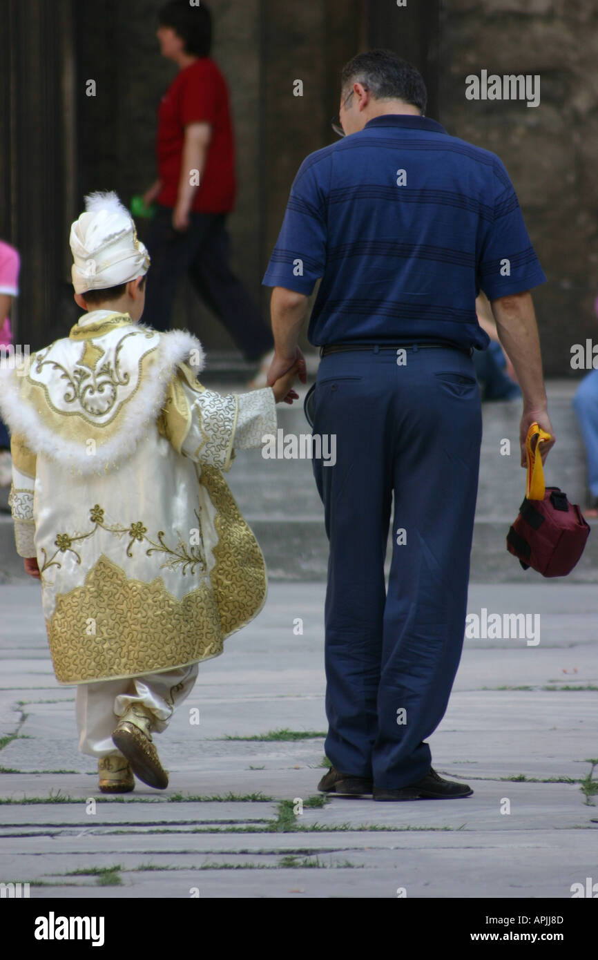 Little boy dressed with traditional sunnetlik on his way to the ...