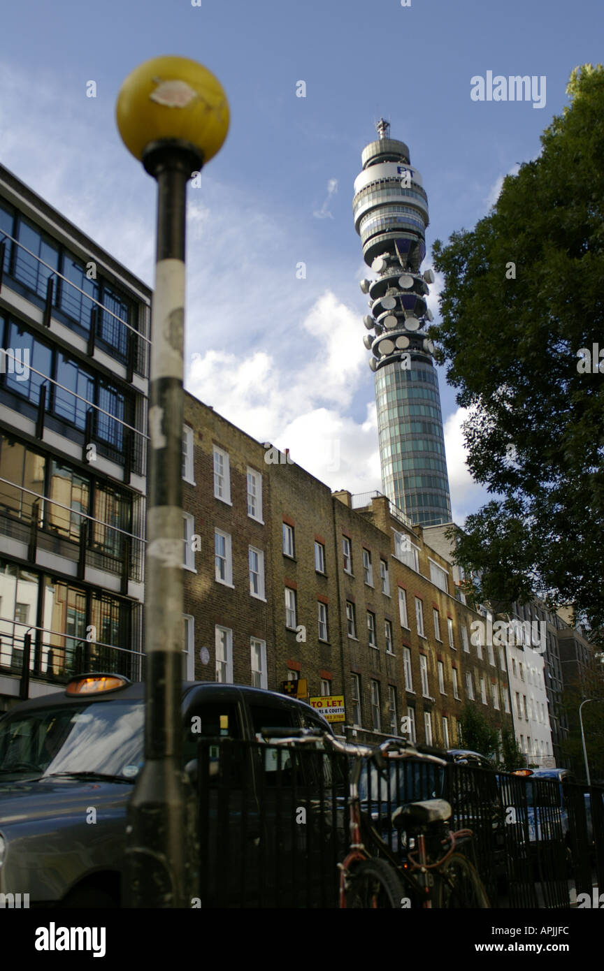 Fitzrovia street scene Post Office Tower London and black cab taxi and ...
