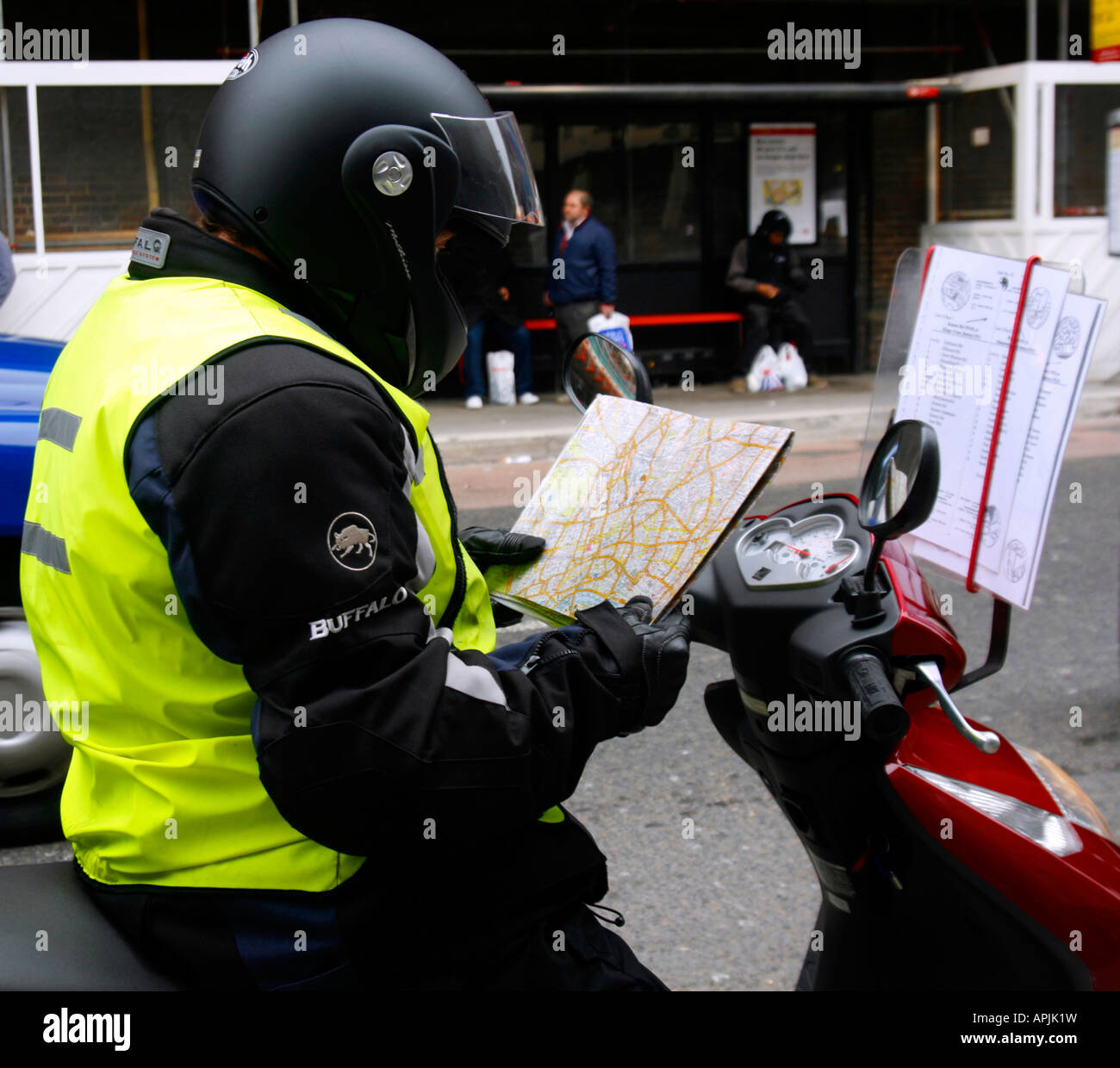 A trainee taxi driver doing ‘The Knoweldge’ in London. Using a small ...