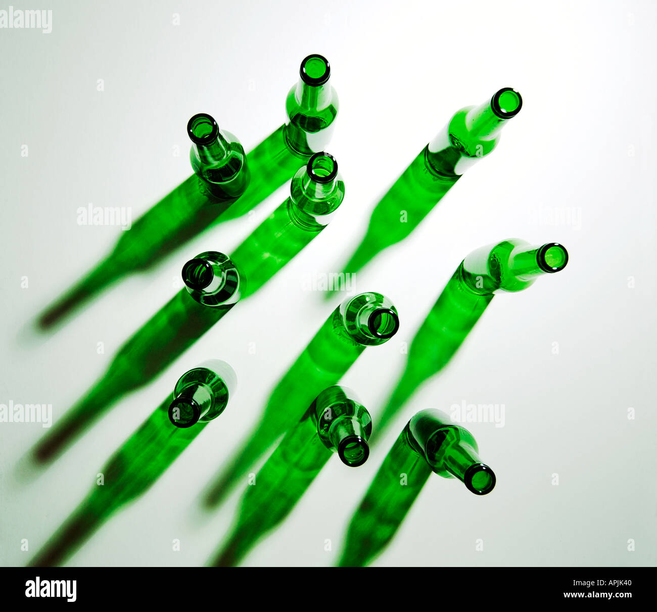 Abstract image of ten green glass bottles isolated on a white ...