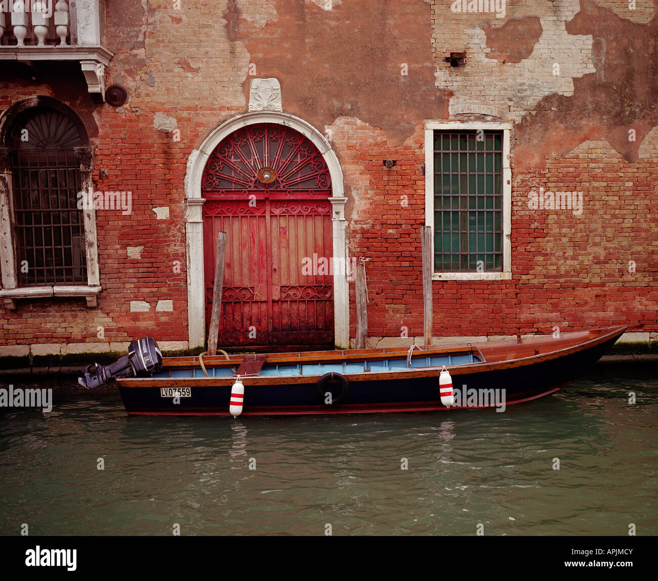 Venice boat in backwater Stock Photo - Alamy