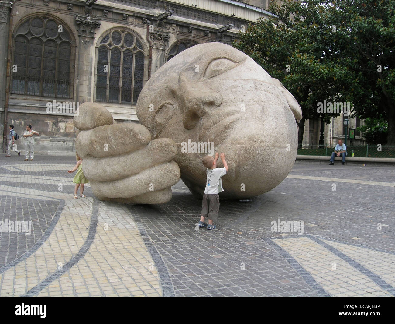 Child touching statue hi-res stock photography and images - Alamy
