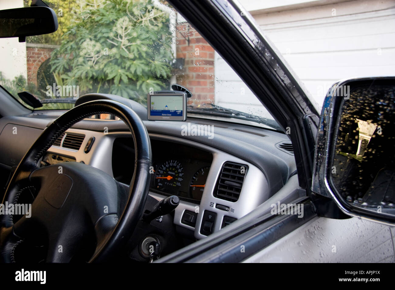 Open car window showing satellite navigation system on dashboard Stock ...