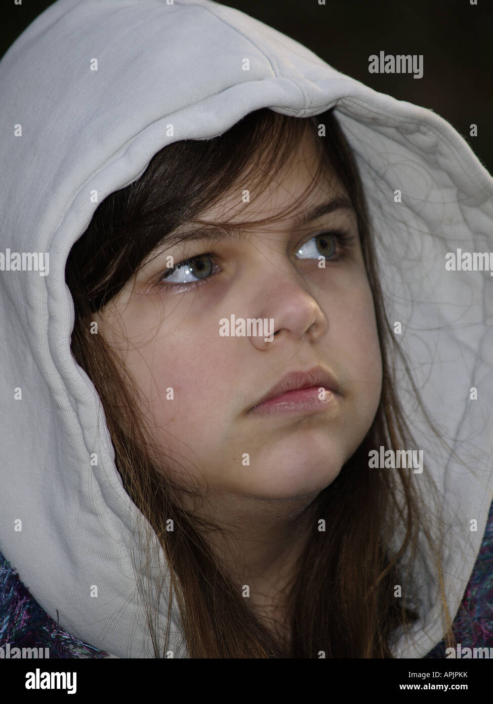 Close up of a teen girl wearing a hood over her head Stock Photo - Alamy