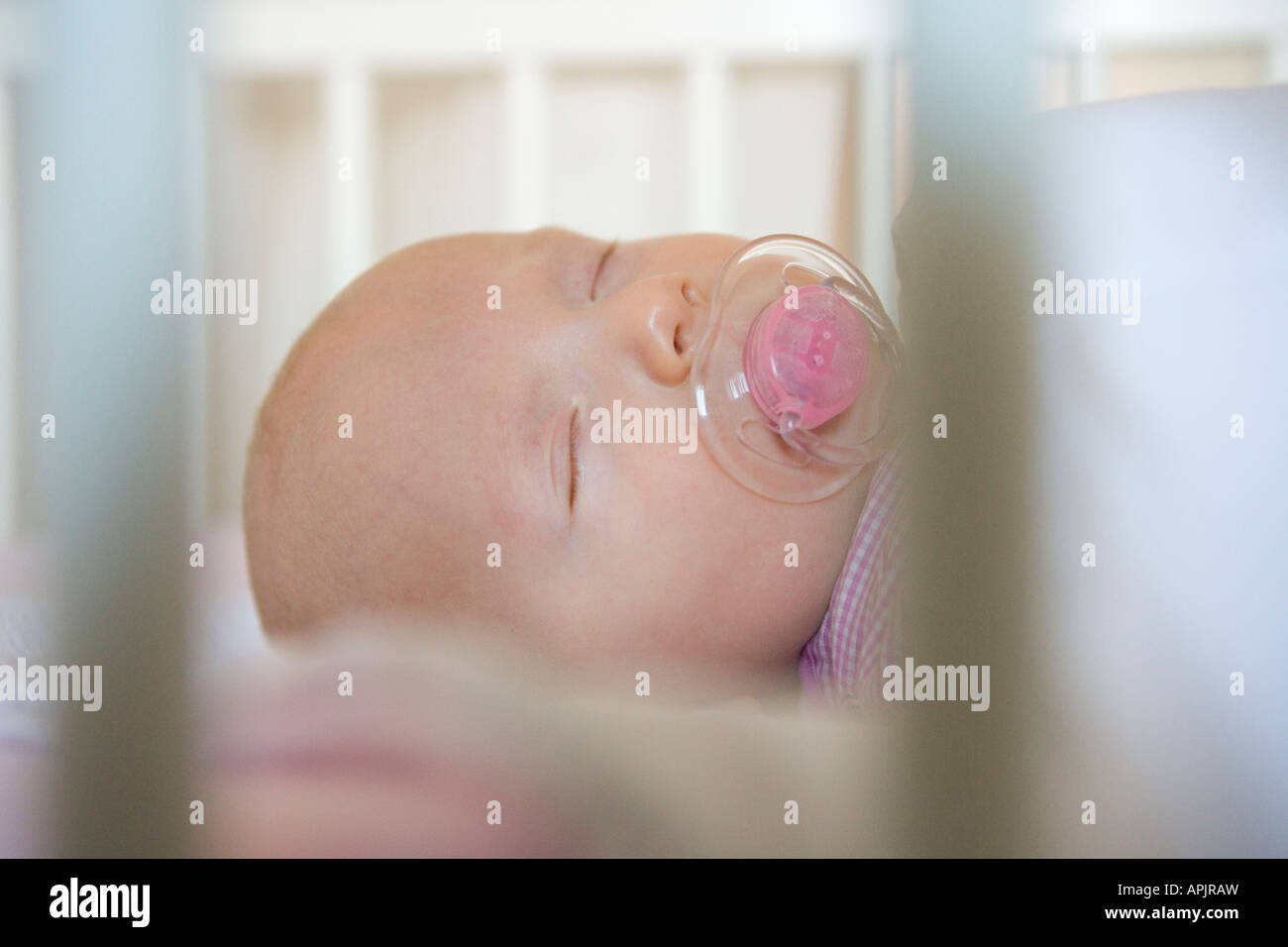 Sleeping baby with a comforter Stock Photo - Alamy
