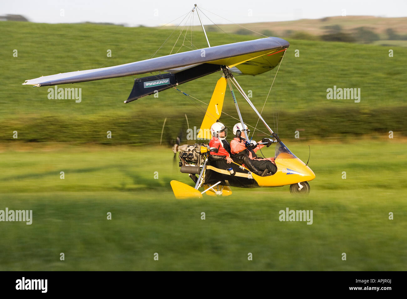 Microlight landing on farmland near Kendal in Cumbria Stock Photo - Alamy