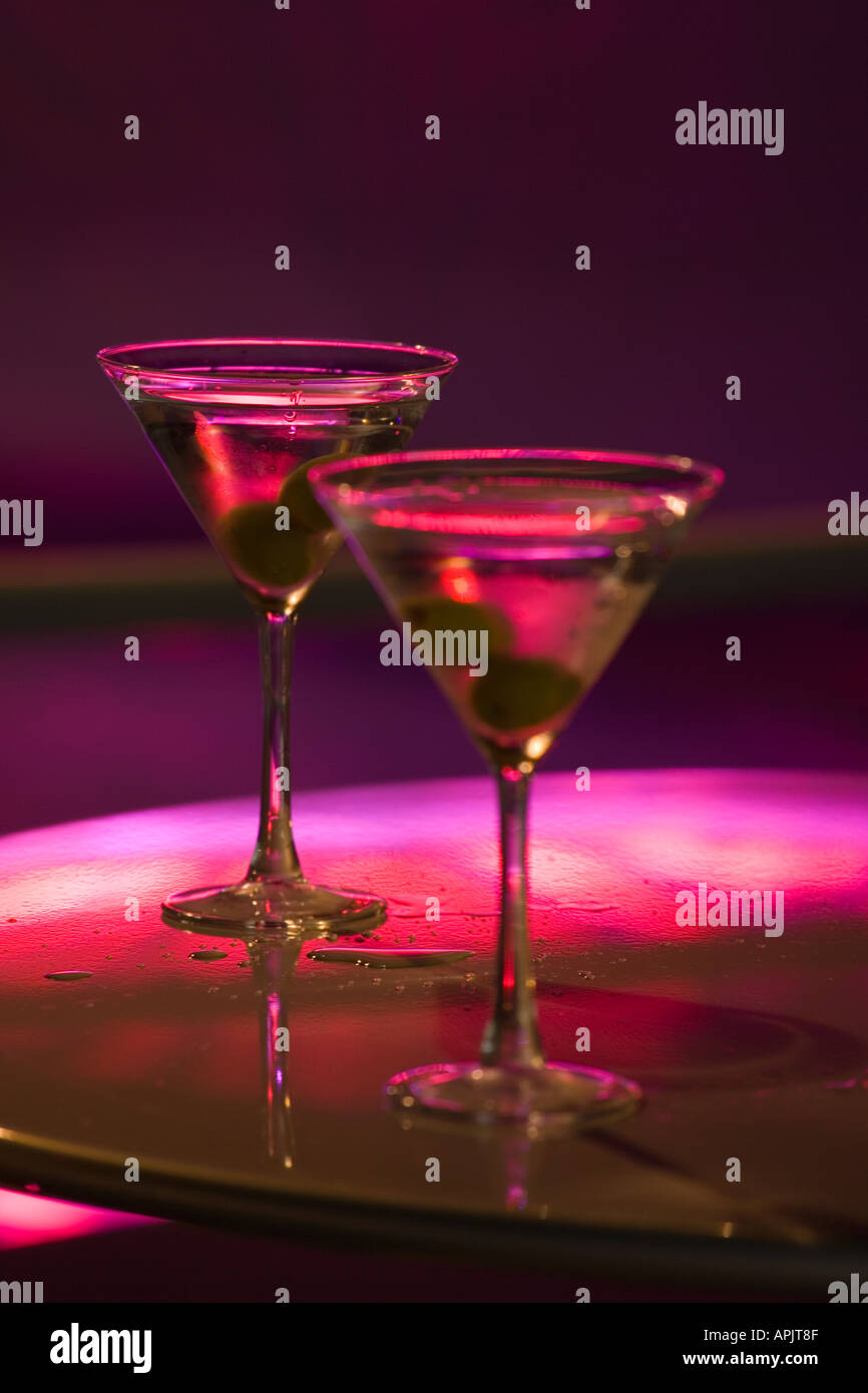 Martini Glasses on a table with club lighting Stock Photo - Alamy