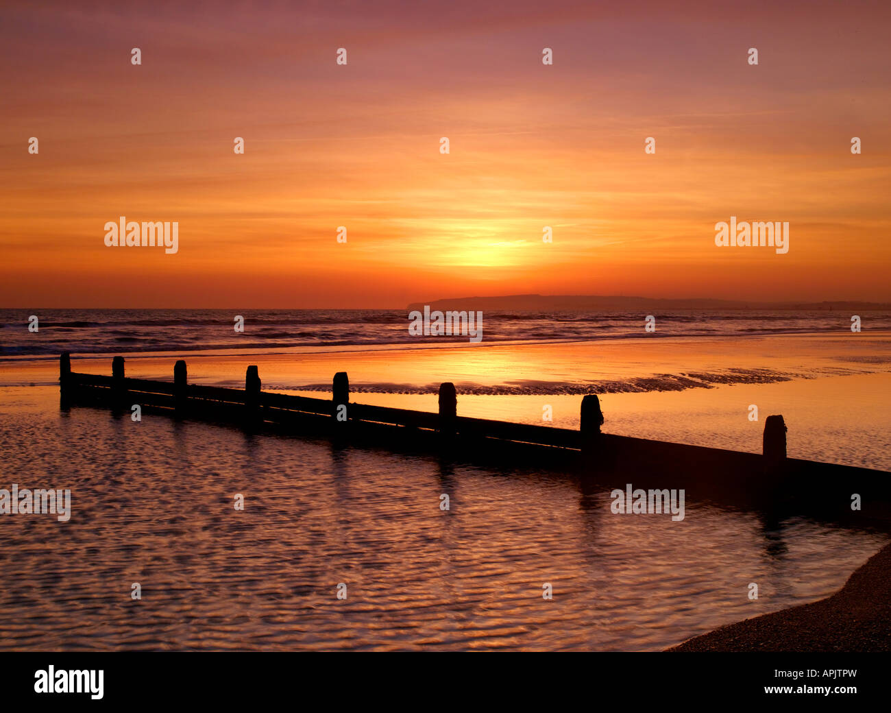 Sunset over Camber Sands and Rye Bay East Sussex England Stock Photo ...