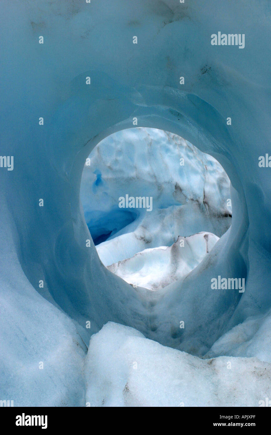 Looking down into deep blue glacier hole Stock Photo - Alamy