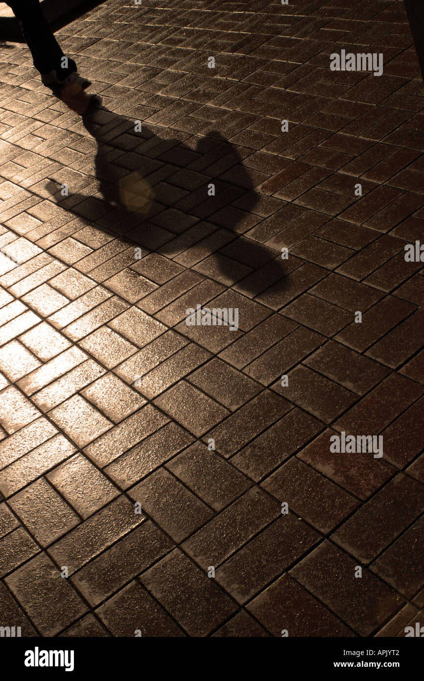 Person reflecting a shadow hi-res stock photography and images - Alamy