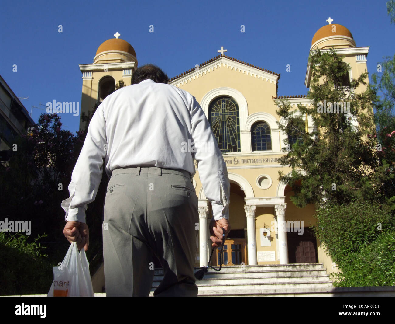 man going to church in athens greece Stock Photo - Alamy