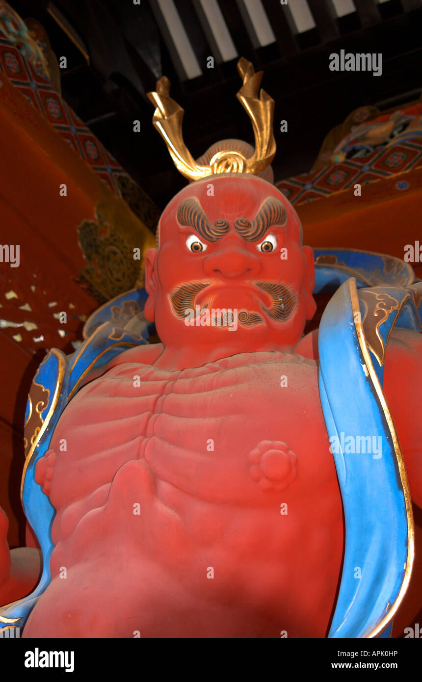 red statue Shinto God in Nikko Japan Stock Photo - Alamy