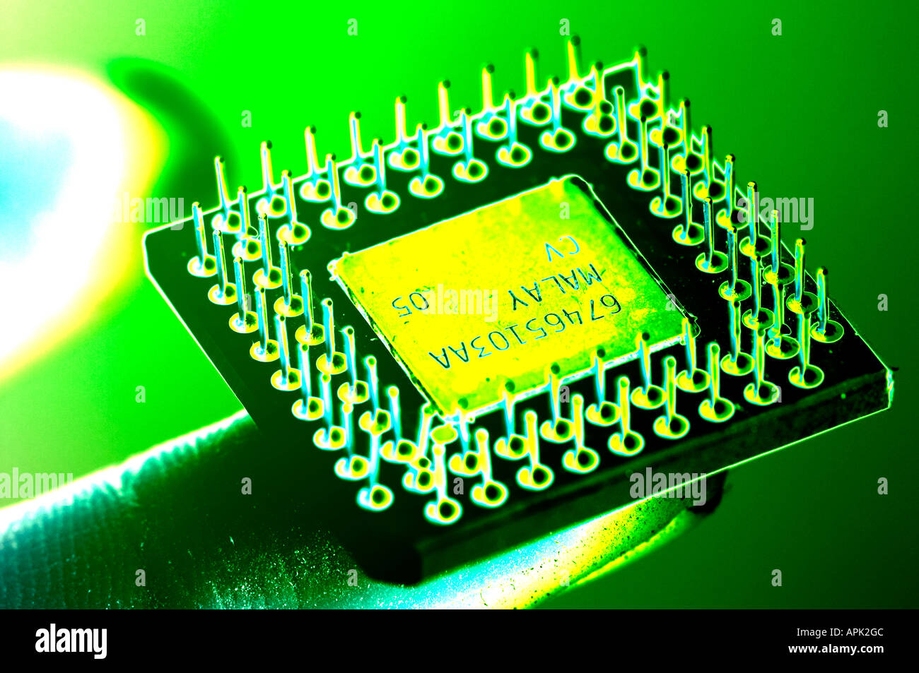 tiny computer processor chip balanced on tip of human finger Stock ...