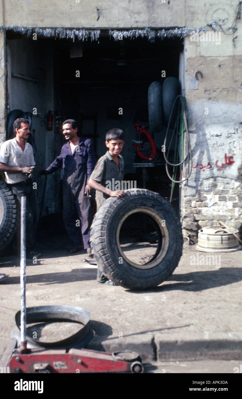 IRAQ BAGHDAD Young boy working in garage to help support his family ...