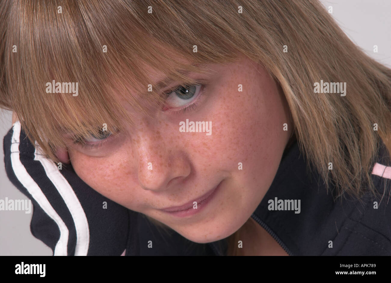 young girl looking into camera Stock Photo - Alamy