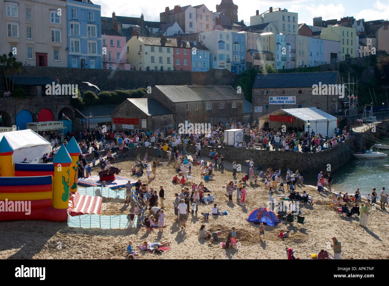Crowded beach and harbour quay in Tenby Pembrokeshire Stock Photo - Alamy