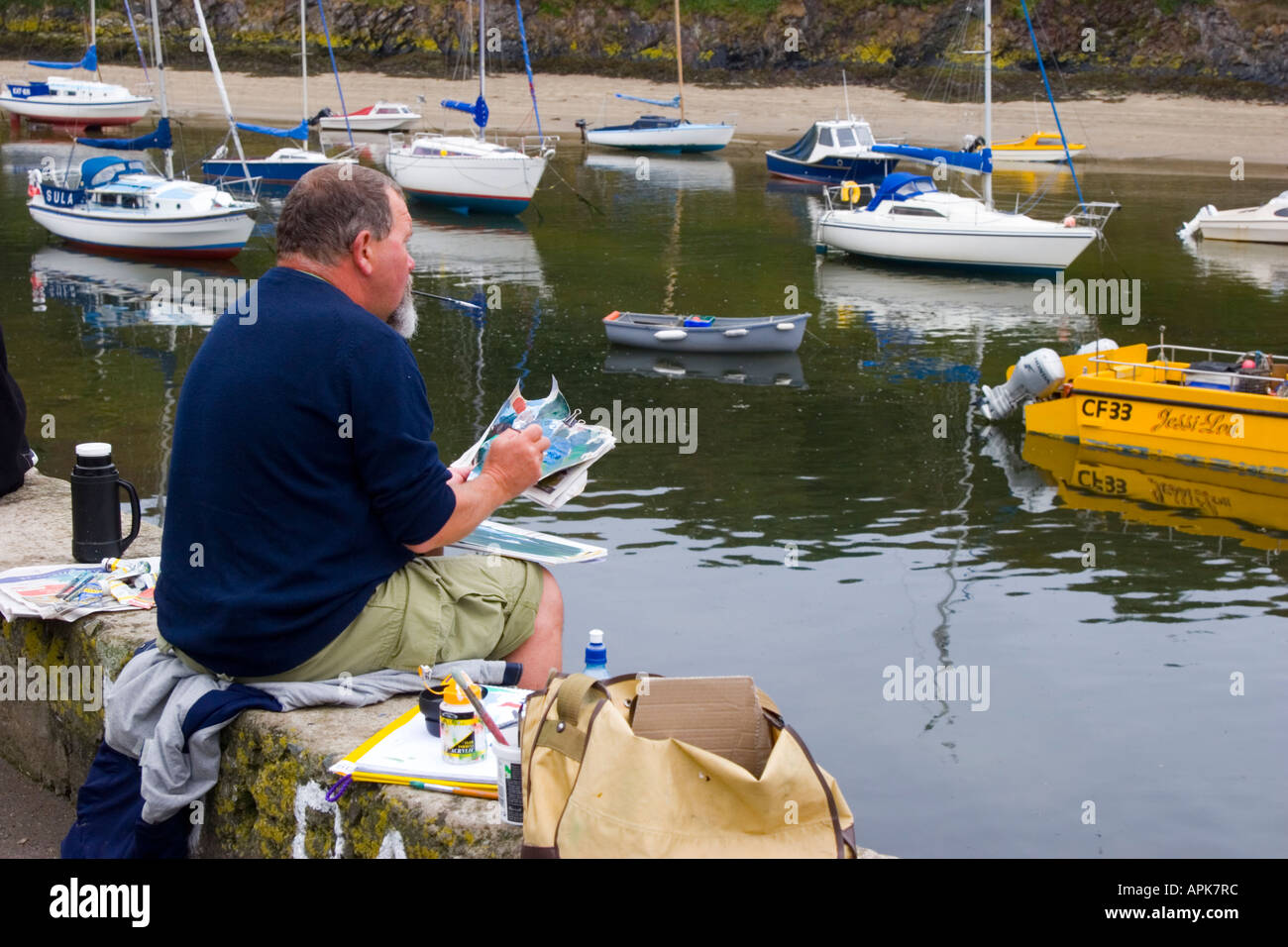 Artist painting in the harbour at Solva in Pembrokeshire Stock Photo ...