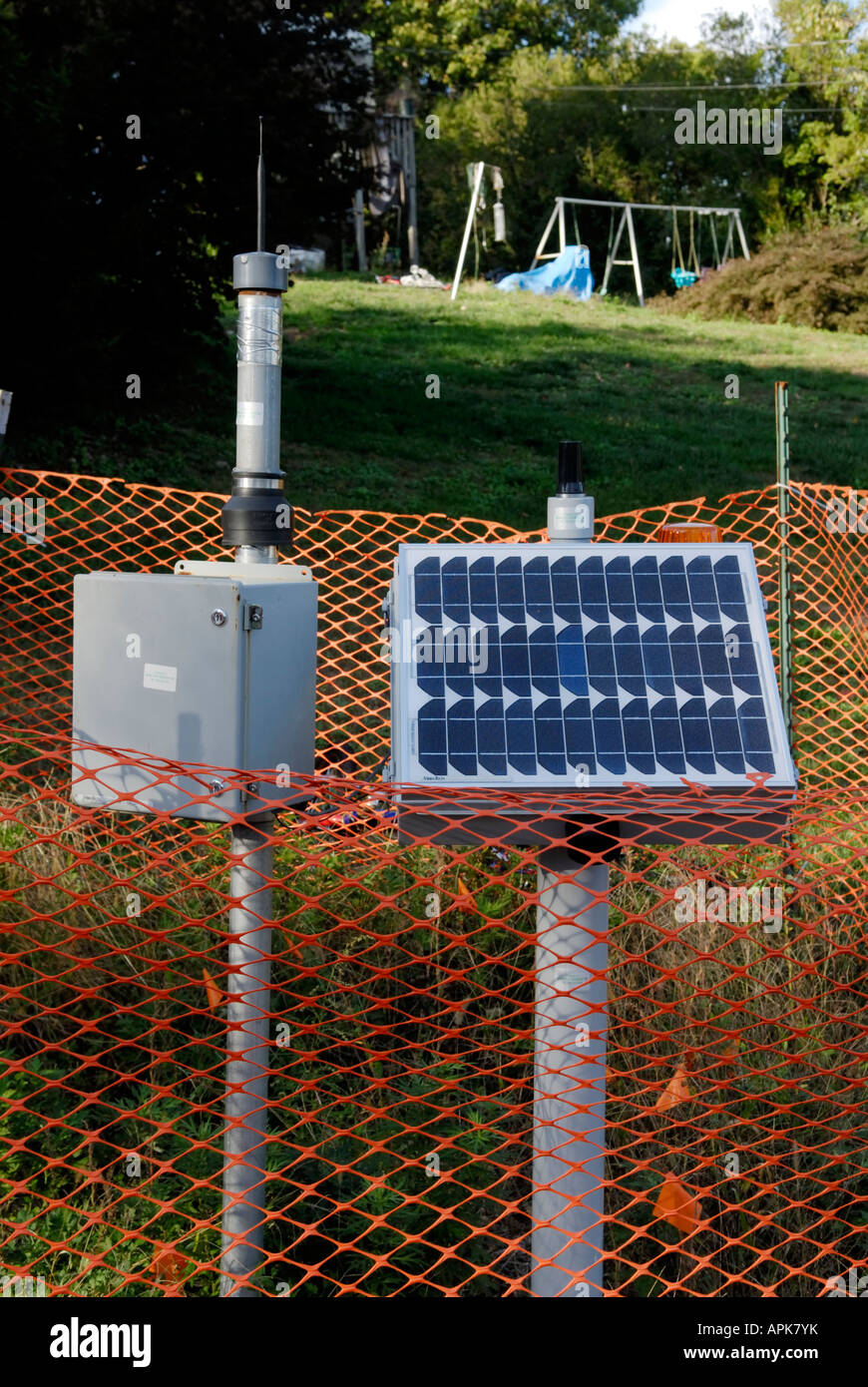 A seismic monitoring station in front of a home in a neighborhood Upper ...
