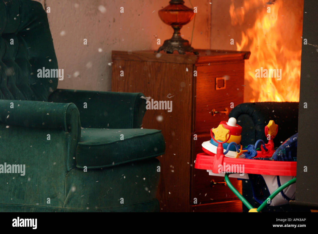 A mock living room set on fire for a demonstration of the quickness on ...