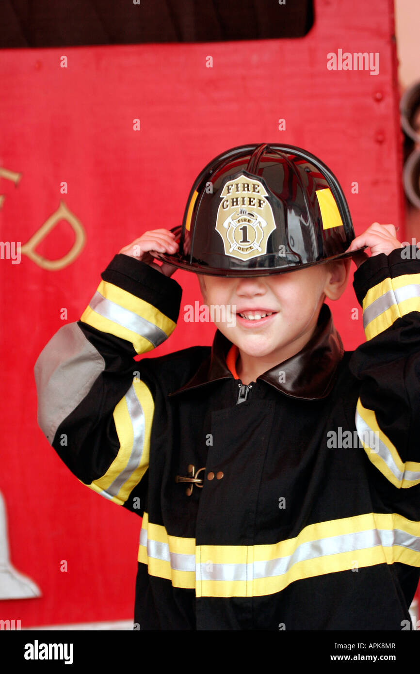 A young future firefighter Fire Chief posing with the Fire Department ...