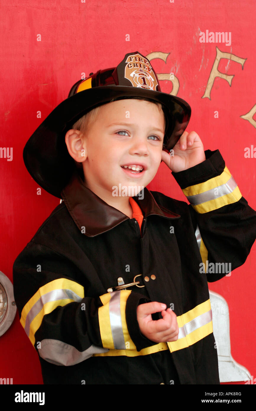 A young future firefighter Fire Chief posing with the Fire Department ...