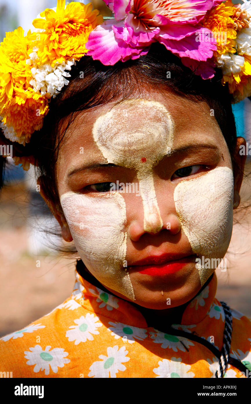 portrait of a young Burmese Girl with traditional face paint made from ...