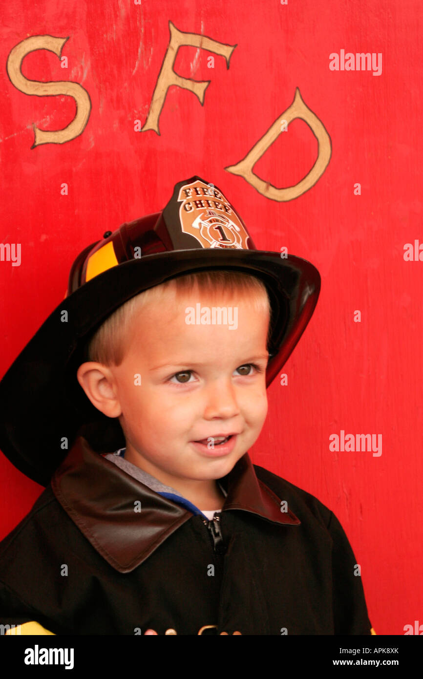 A young future firefighter Fire Chief posing with the Fire Department ...