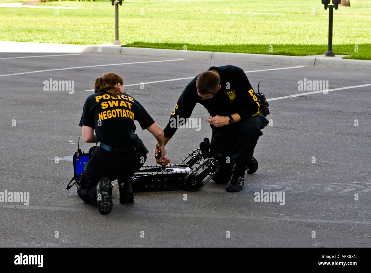 Police SWAT Negotiators Working on a Tactical Robot Stock Photo - Alamy