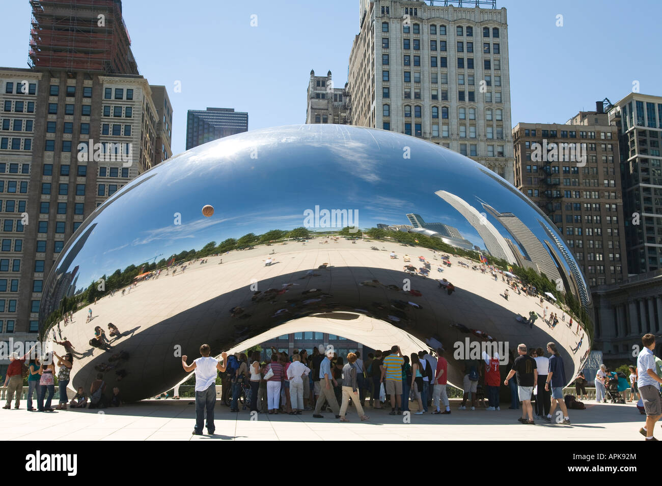 ILLINOIS Chicago Boy throwing basketball in air next to the Bean Cloud ...