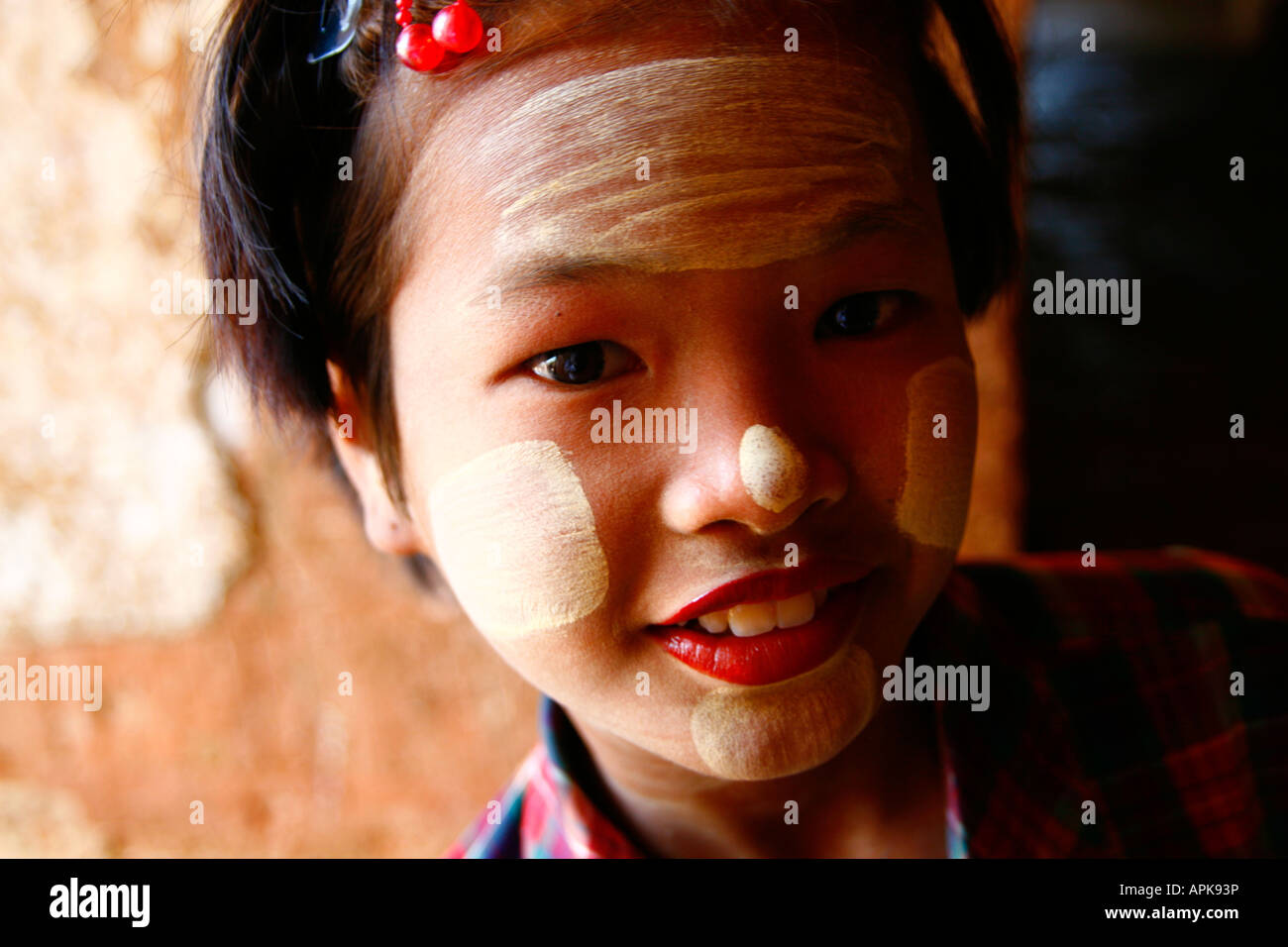 Burmese Girl with traditional face paint made from the thanaka plant ...