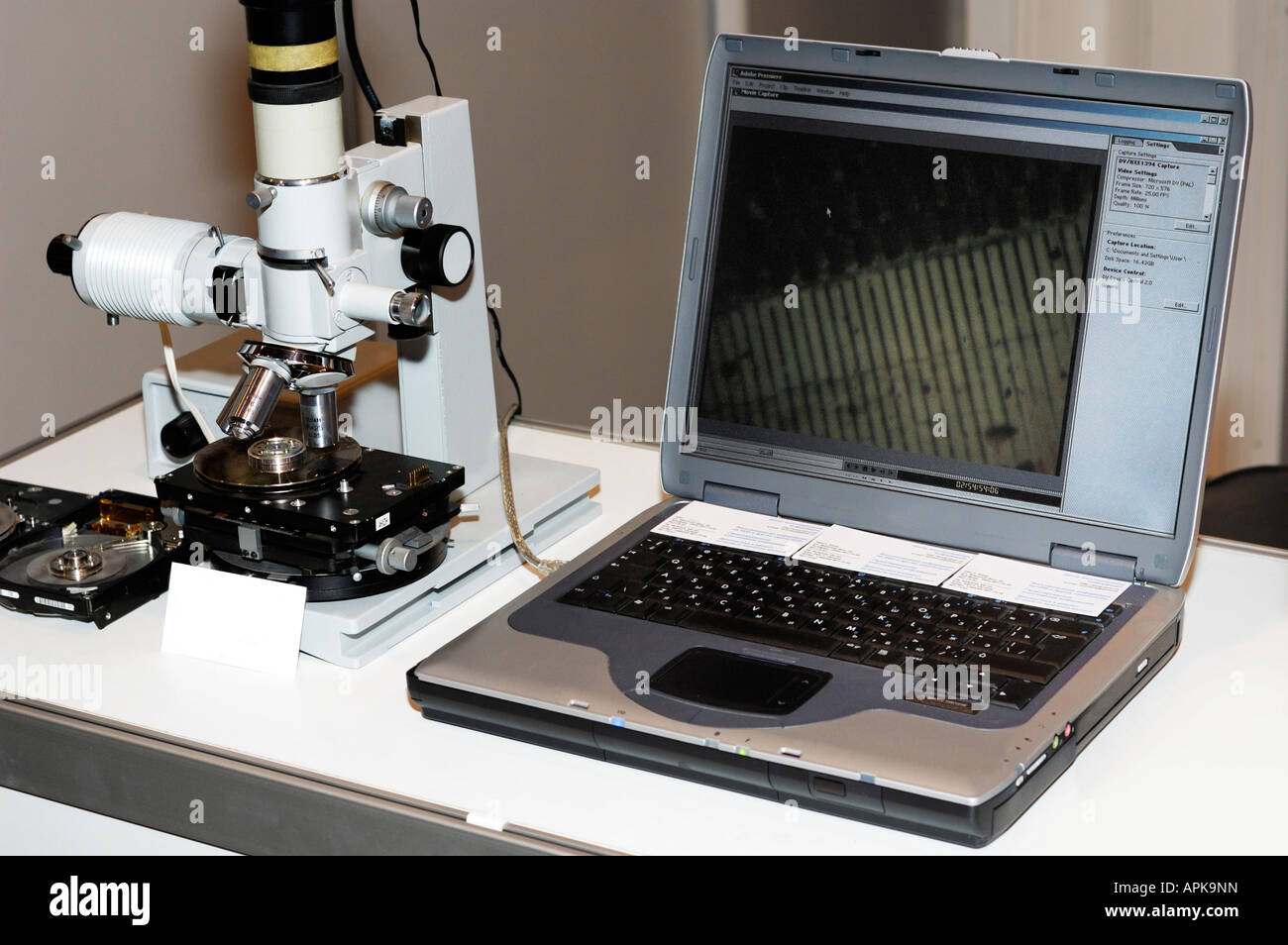 Hard disk drive under a microscope Stock Photo - Alamy