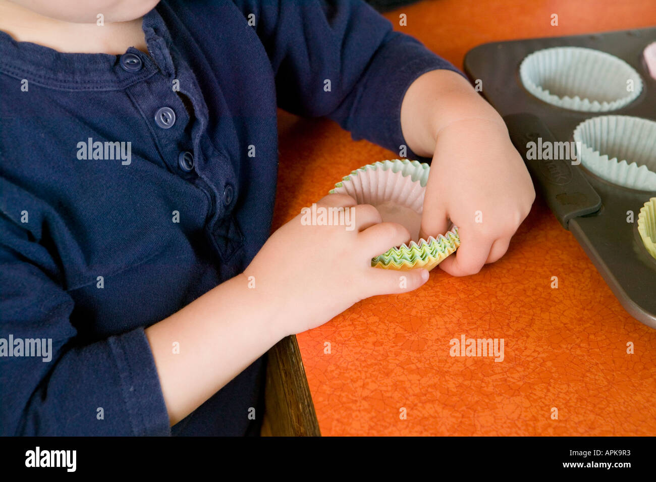 Helping to Make Cup Cakes Stock Photo - Alamy