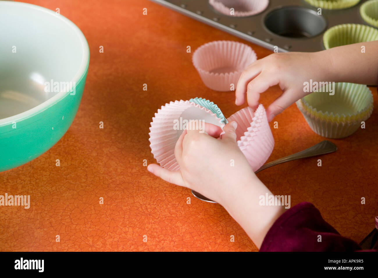 Helping to Make Cup Cakes Stock Photo - Alamy