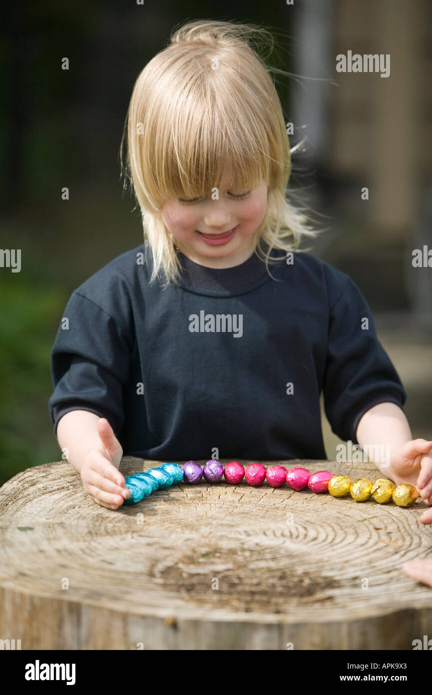 Children Sorting Easter Eggs Stock Photo - Alamy