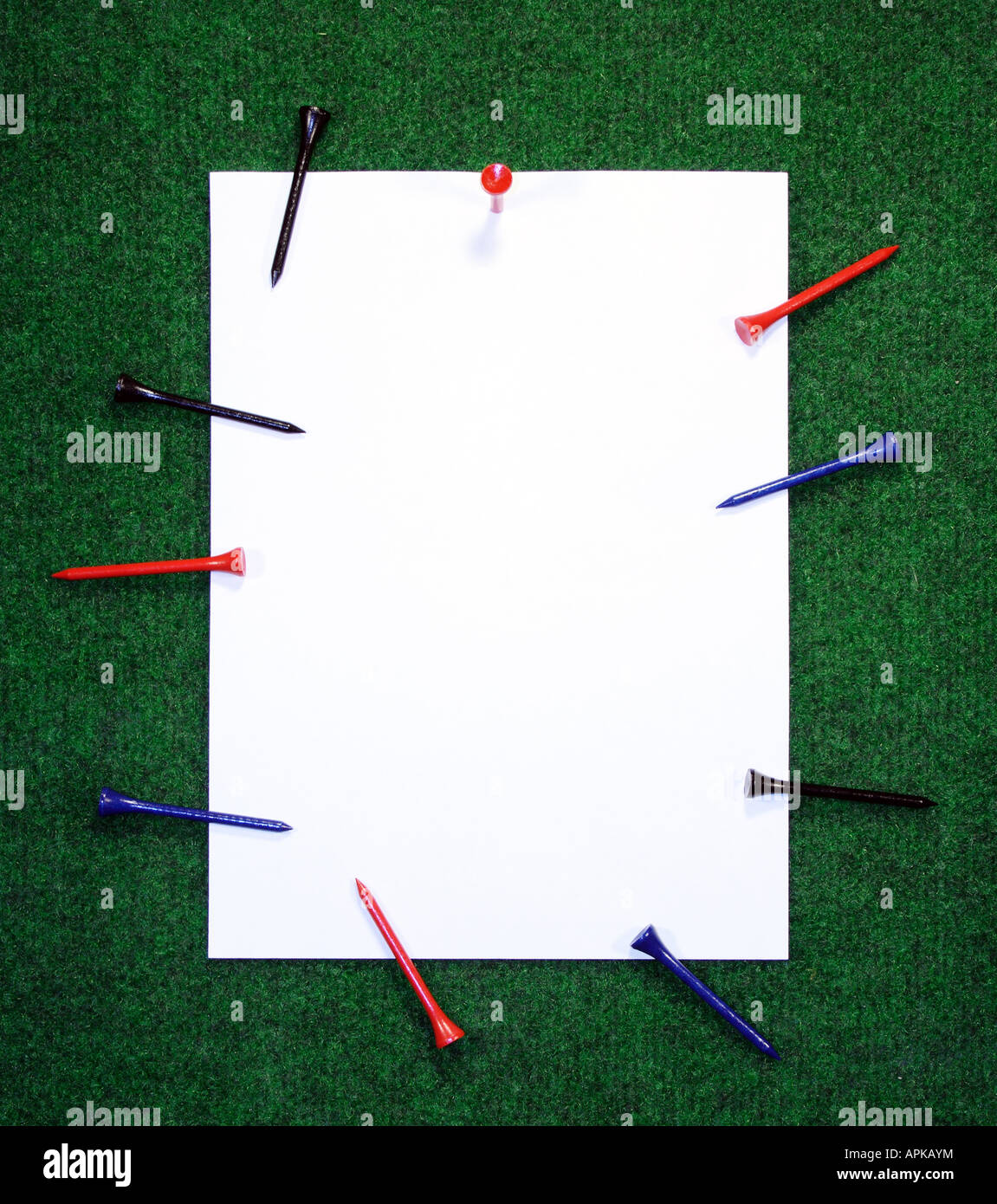 Golf note with white message area and pegs lying around Stock Photo - Alamy