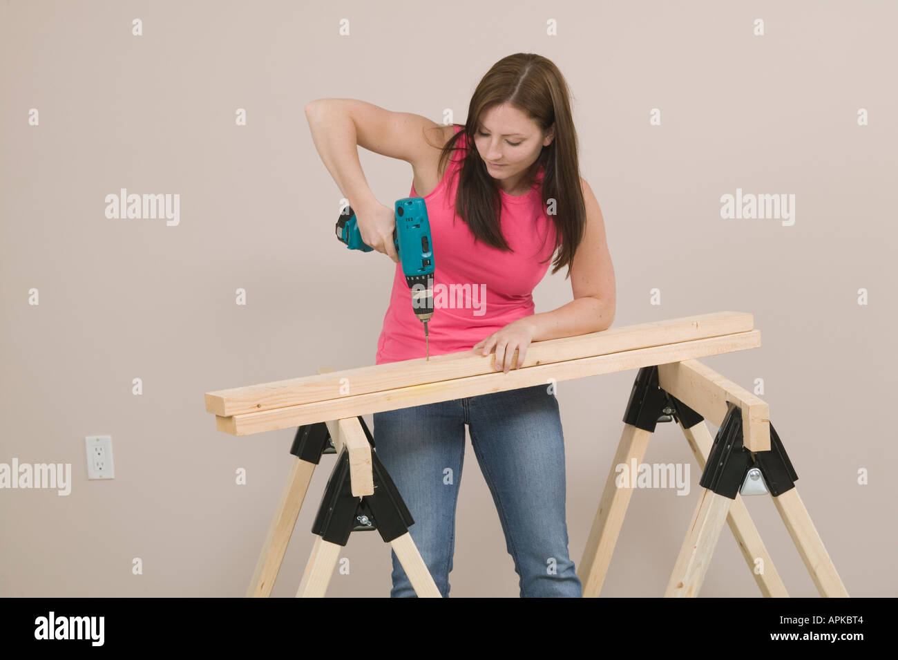 Woman Using a Power Screwdriver Drill Stock Photo - Alamy