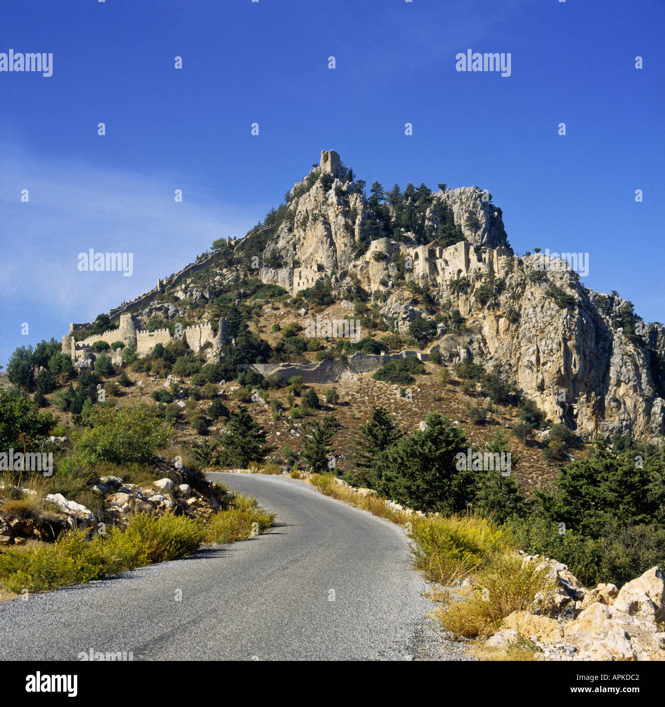 Curving narrow country road sweeping towards impressive view of the ...