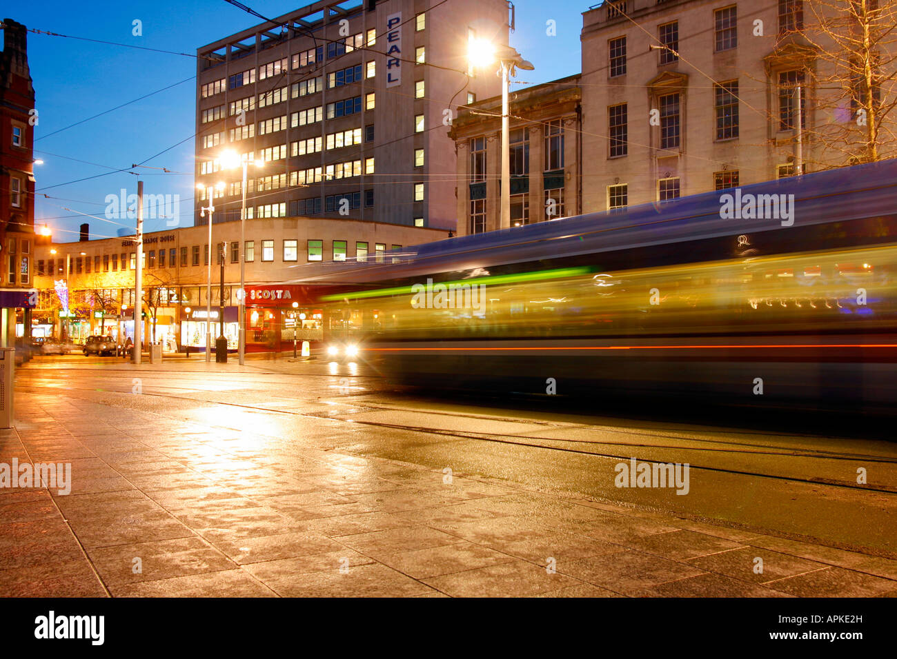 The blur of a Nottingham tram at Night-time in Nottinghams Market ...