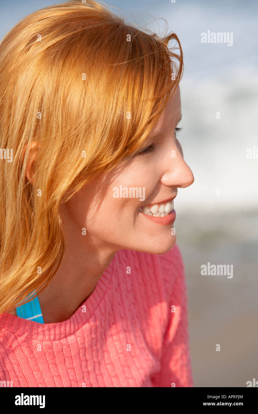 Young woman with ginger hair smiling (profile Stock Photo - Alamy