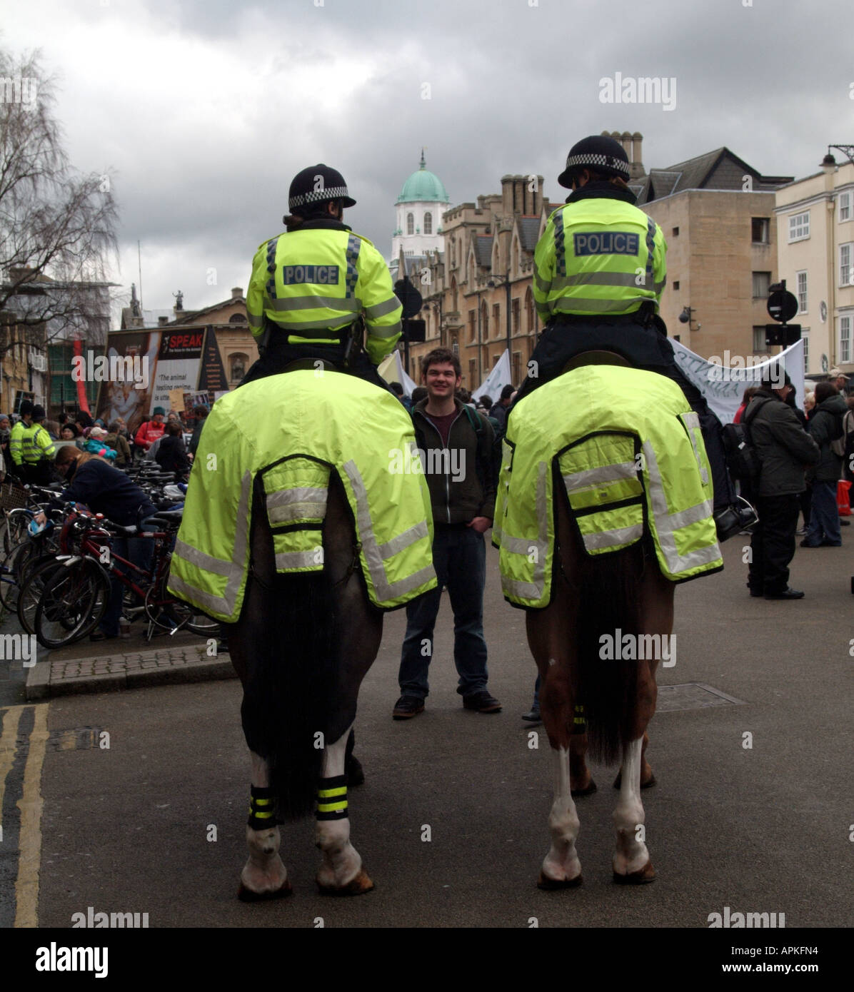 Rear view of two mounted Police horsemen at demonstration in Broad ...