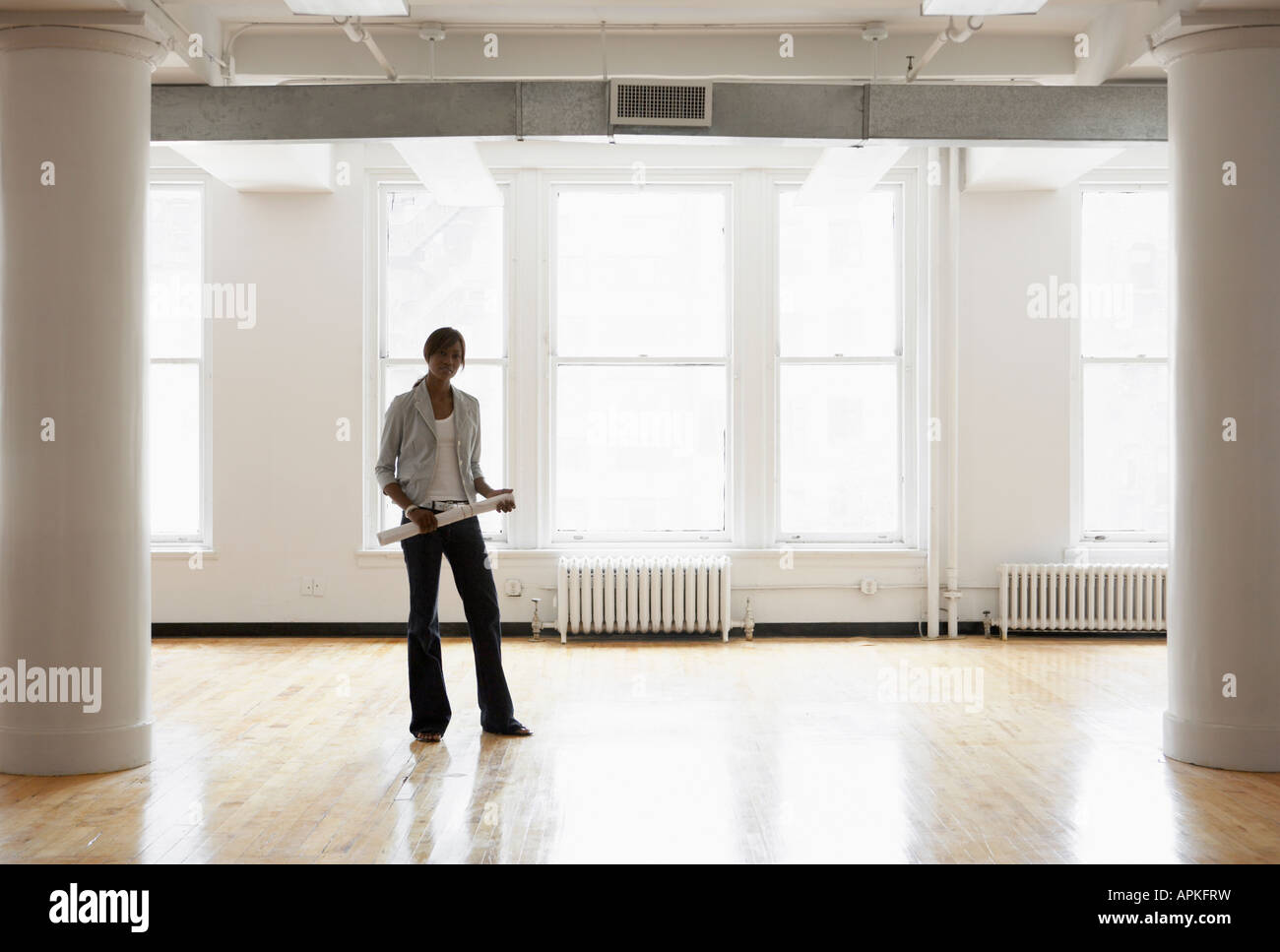 Female architect in empty room Stock Photo - Alamy