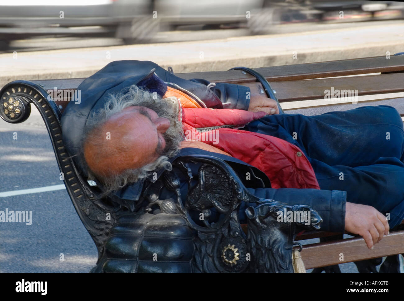 Homeless man sleeping on a bench, Embankment, London, UK Stock Photo ...
