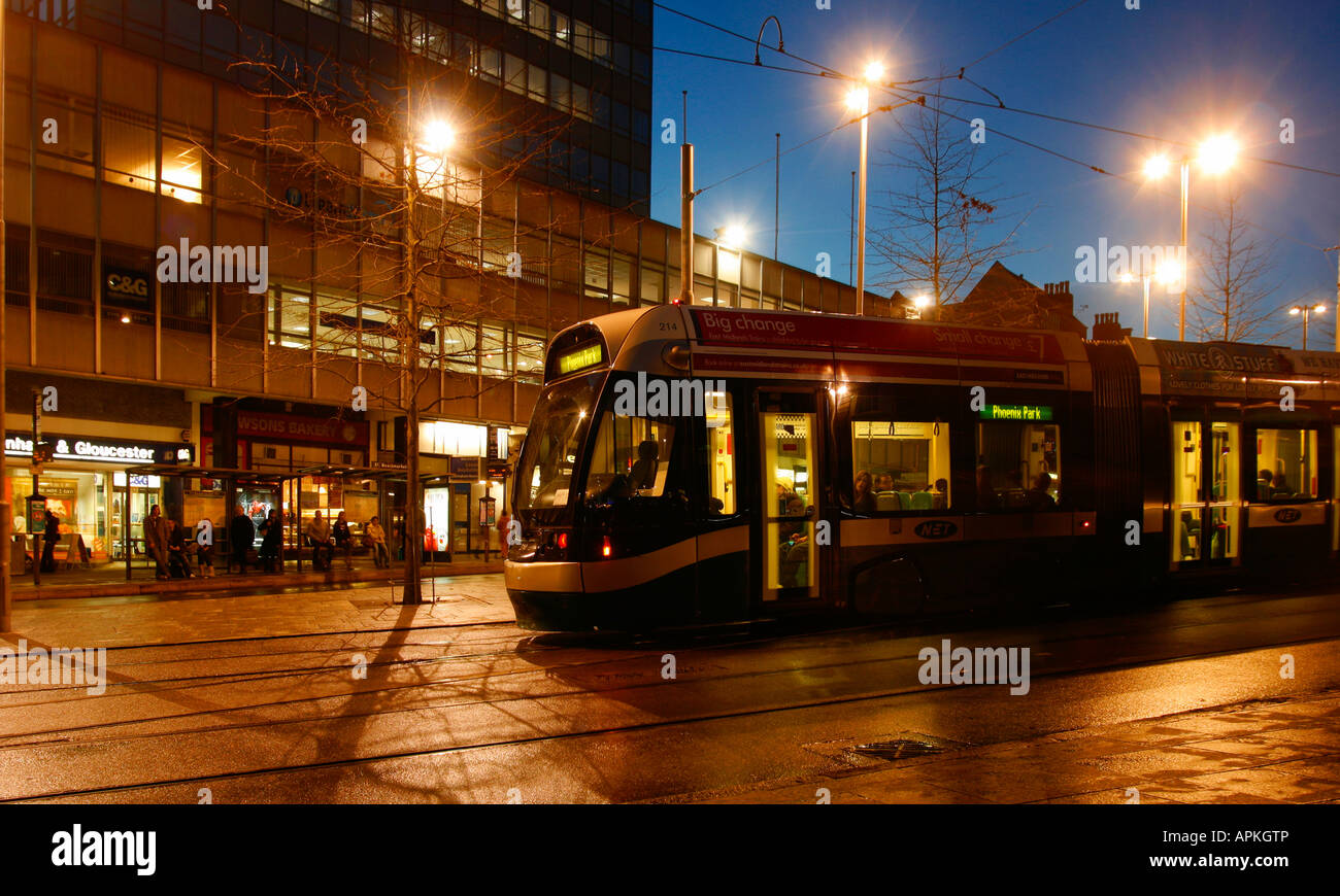 The blur of a Nottingham tram at Night-time in Nottinghams Market ...