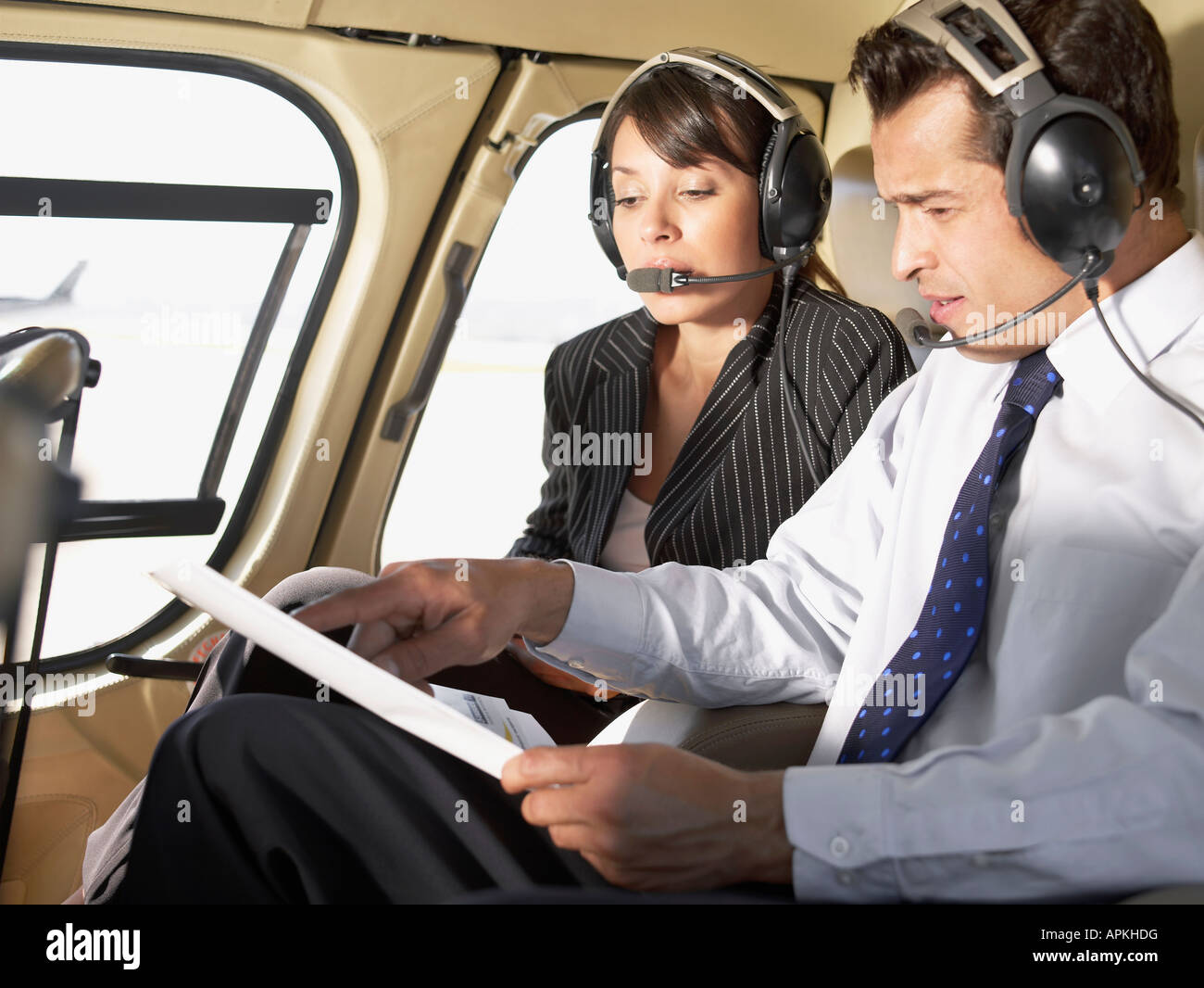 Two business people wearing headsets hi-res stock photography and ...